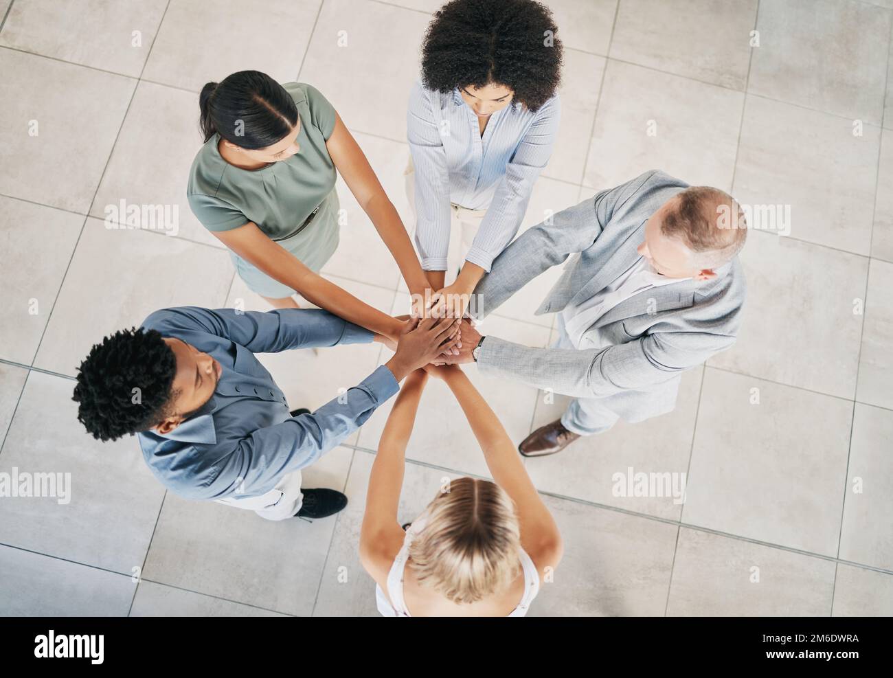 Office, business people and top view of a stack of hands for celebration, motivation or team ...
