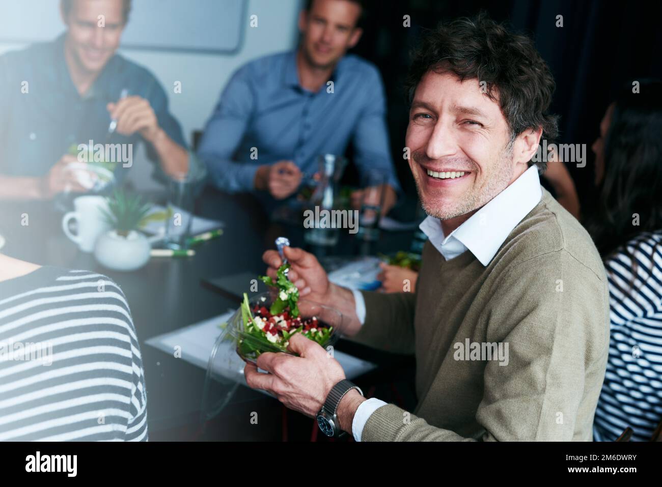 Eating well keeps me focused in the office. Portrait of an office ...