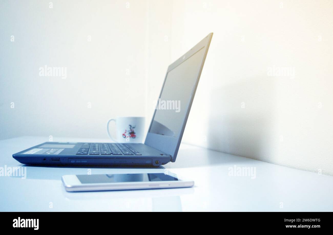 Using a laptop for office work Stock Photo - Alamy