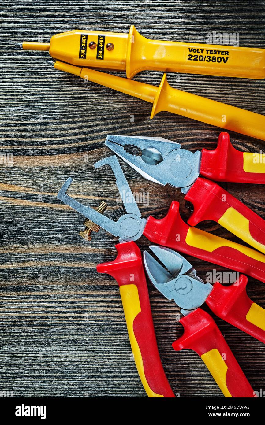 Electric tester insulated wire strippers cutting nippers pliers on wood ...