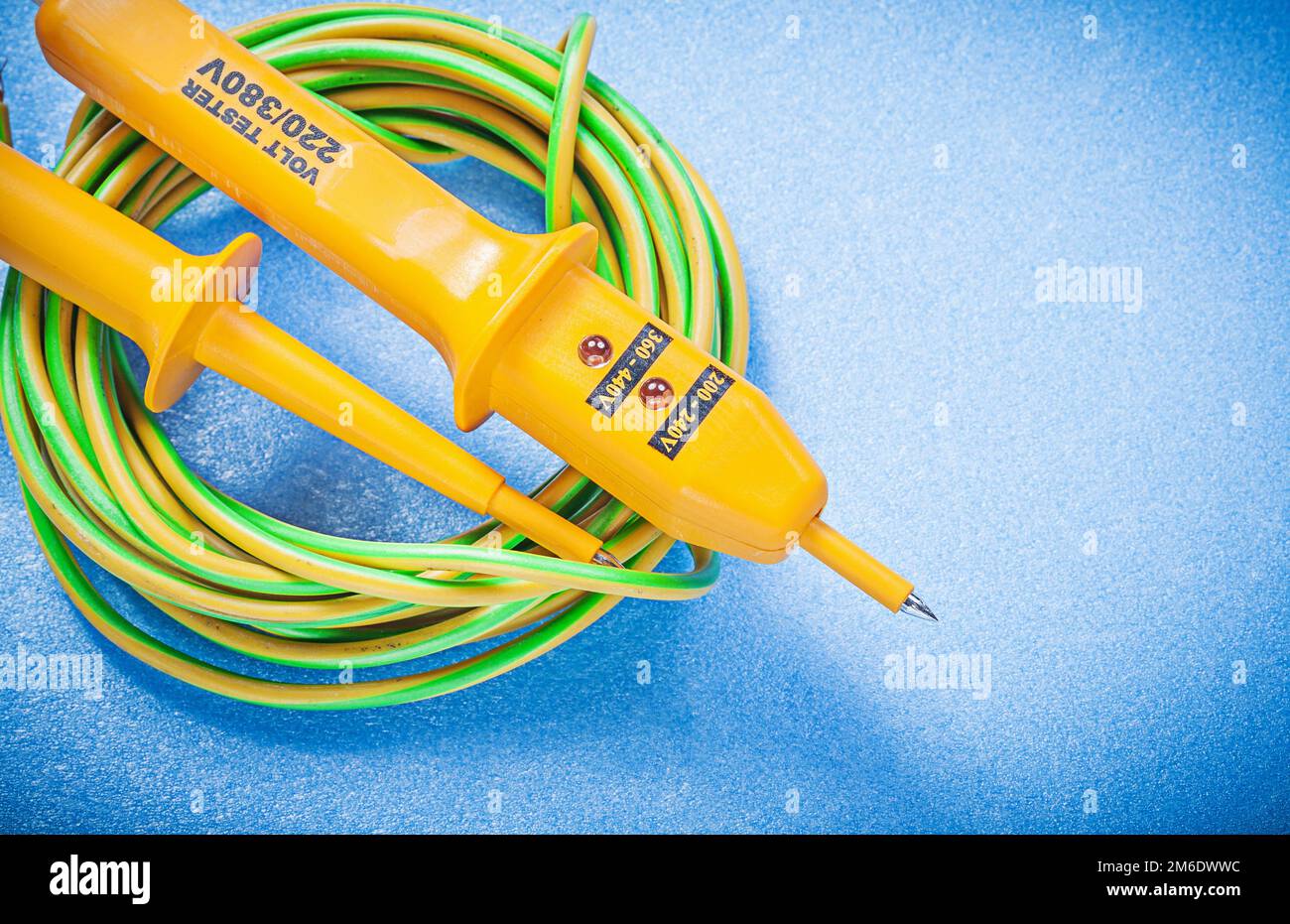 Electric tester wire on blue background electricity concept Stock Photo ...