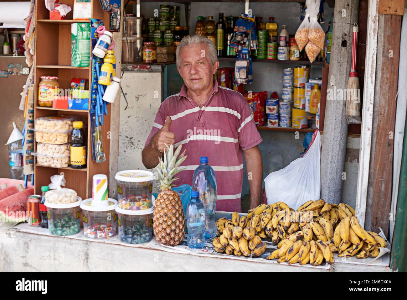 This is his livelihood. Portrait of a street vendor selling a variety ...