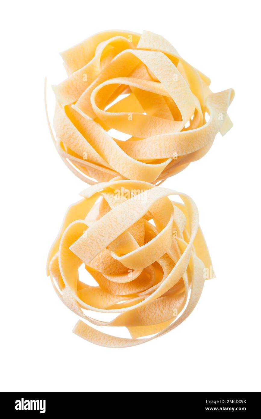 Italian uncooked pasta isolated on white Stock Photo - Alamy