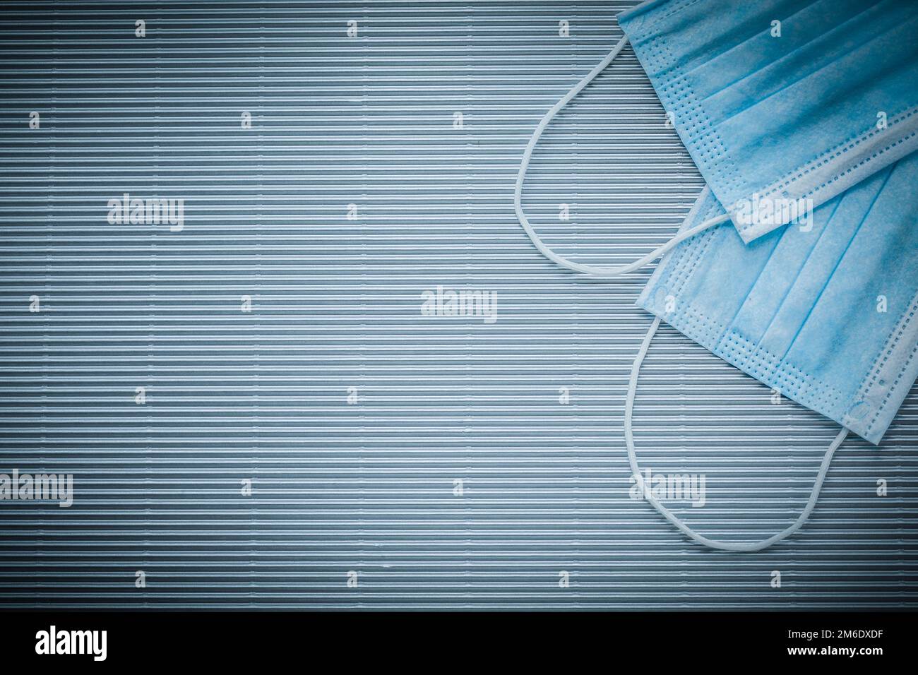 Medical disposable sterile masks on striped background Stock Photo - Alamy