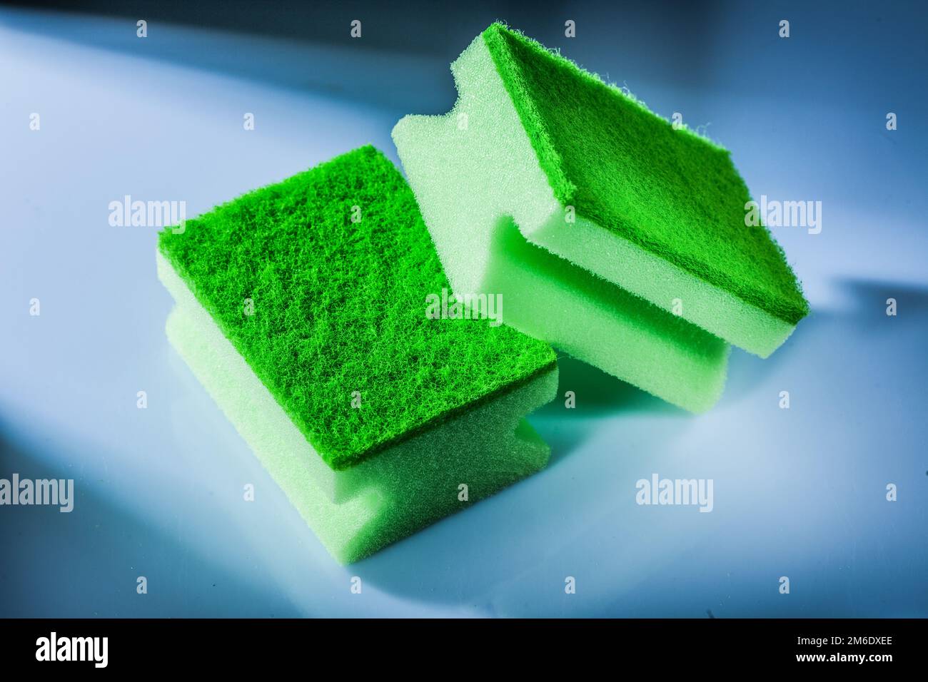 New green sponges on white surface Stock Photo - Alamy