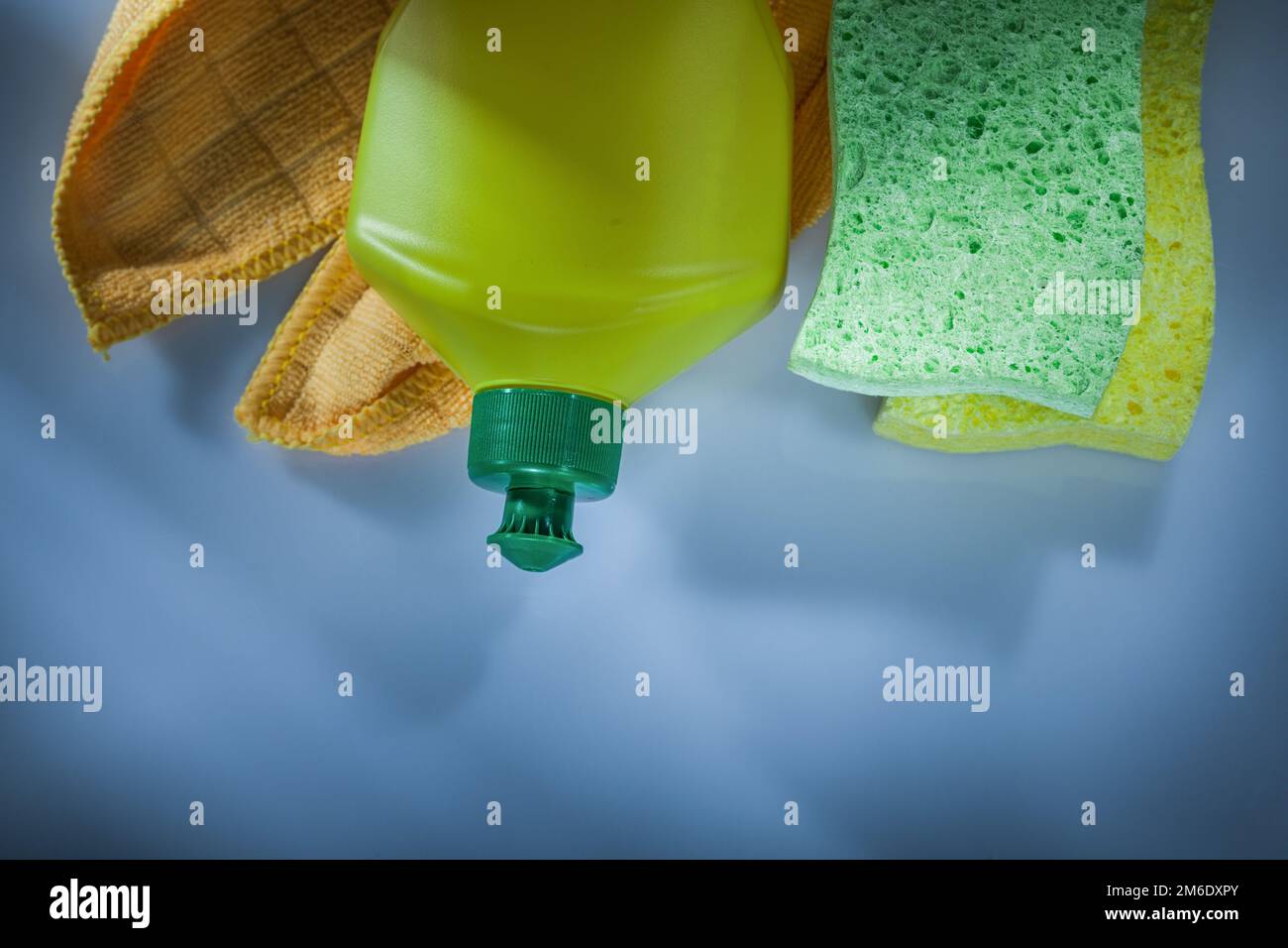 Plastic bottle washing sponge cloth on white surface Stock Photo - Alamy