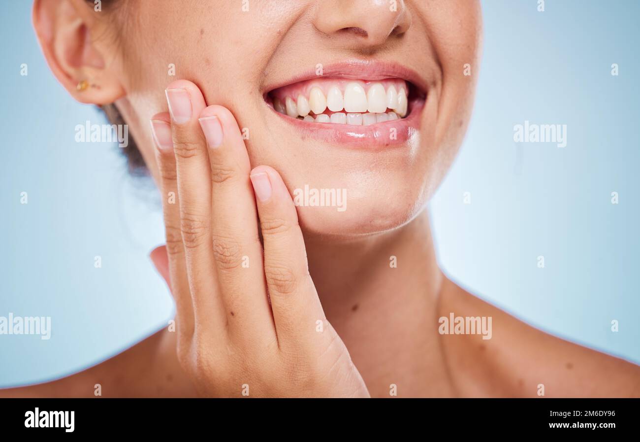 Beauty, teeth and face with woman and hand for manicure, nail care and ...