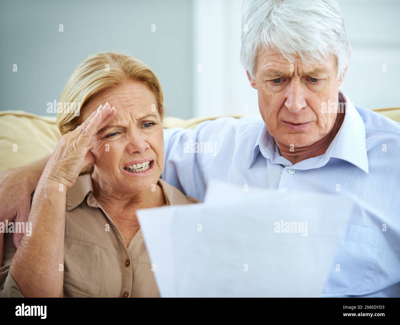 Budgeting burdens. an elderly couple looking frustrated while going ...