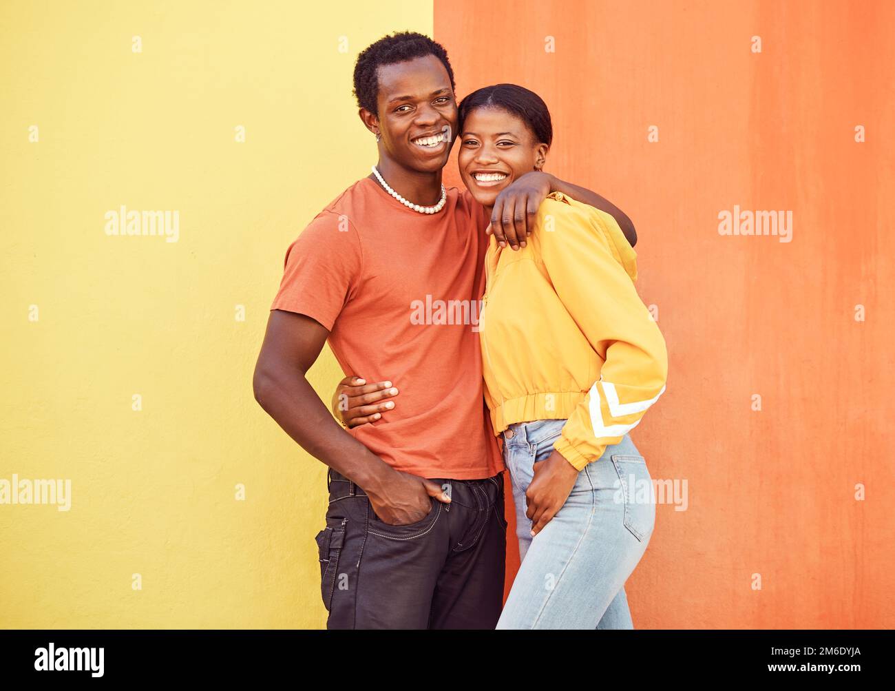 Black couple, youth and fashion with gen z, hug and together with color ...