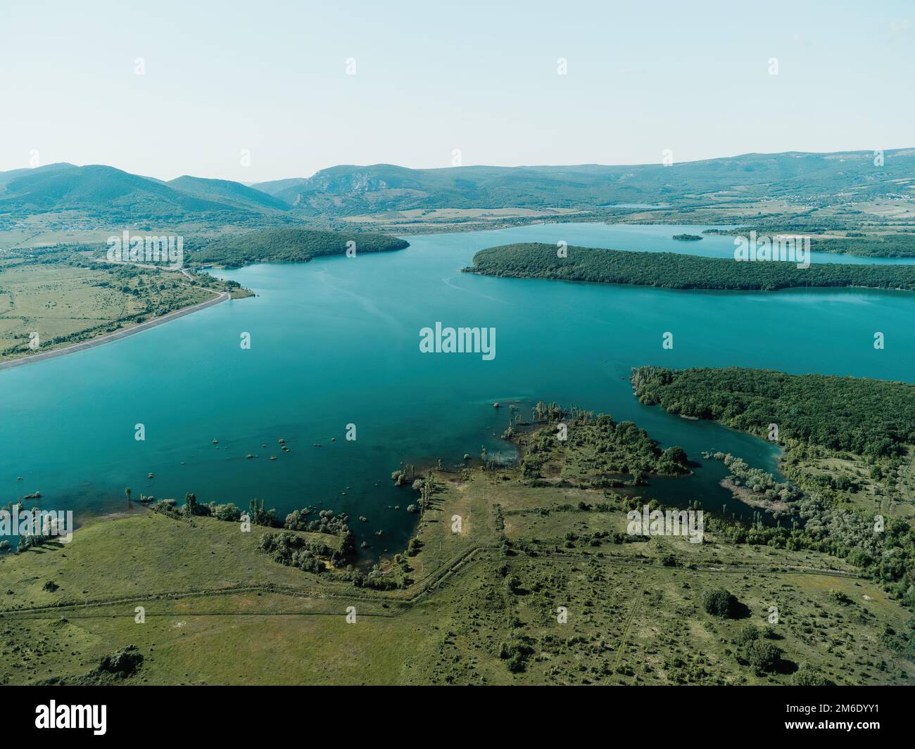 Aerial view on mountain lake. Drone over water reservoir at mountain ...