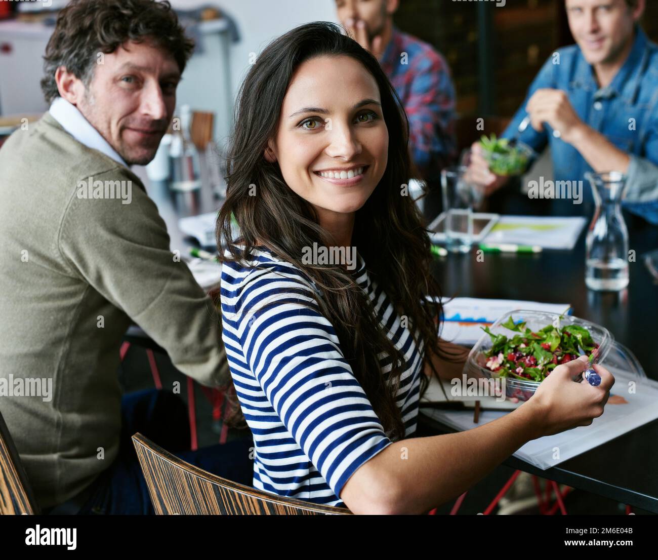 Healthy eating keeps the office up and running. Portrait of a young ...