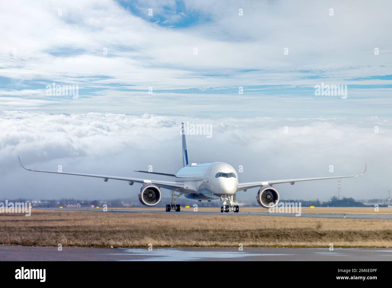 Passenger jet airliner is traveling to the runway for takeoff against ...