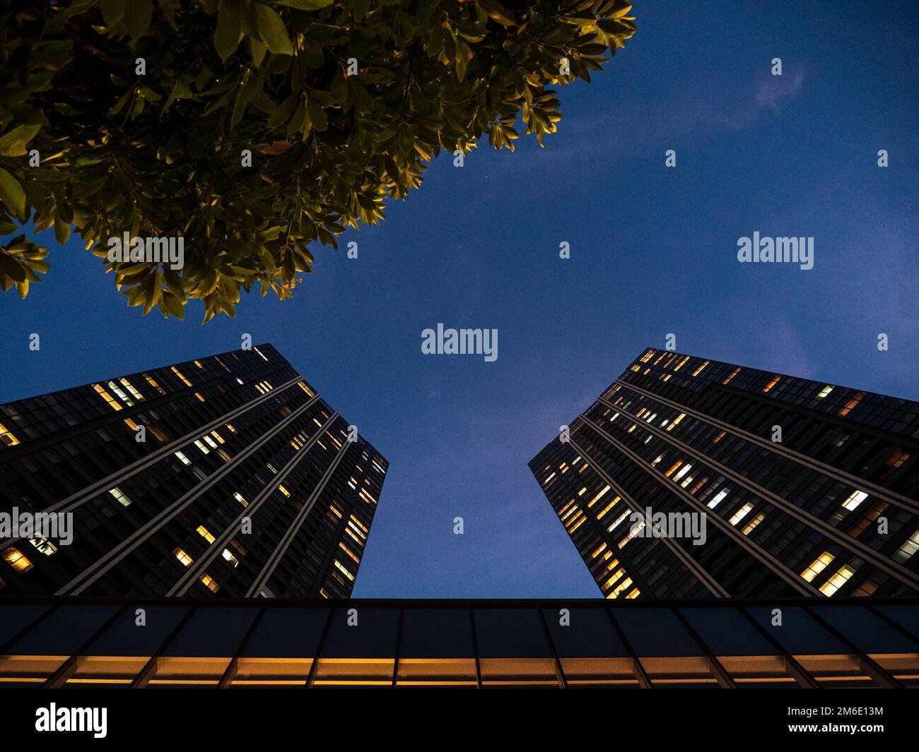 High rise apartments lit up at night in the Tokyo skyline Stock Photo ...