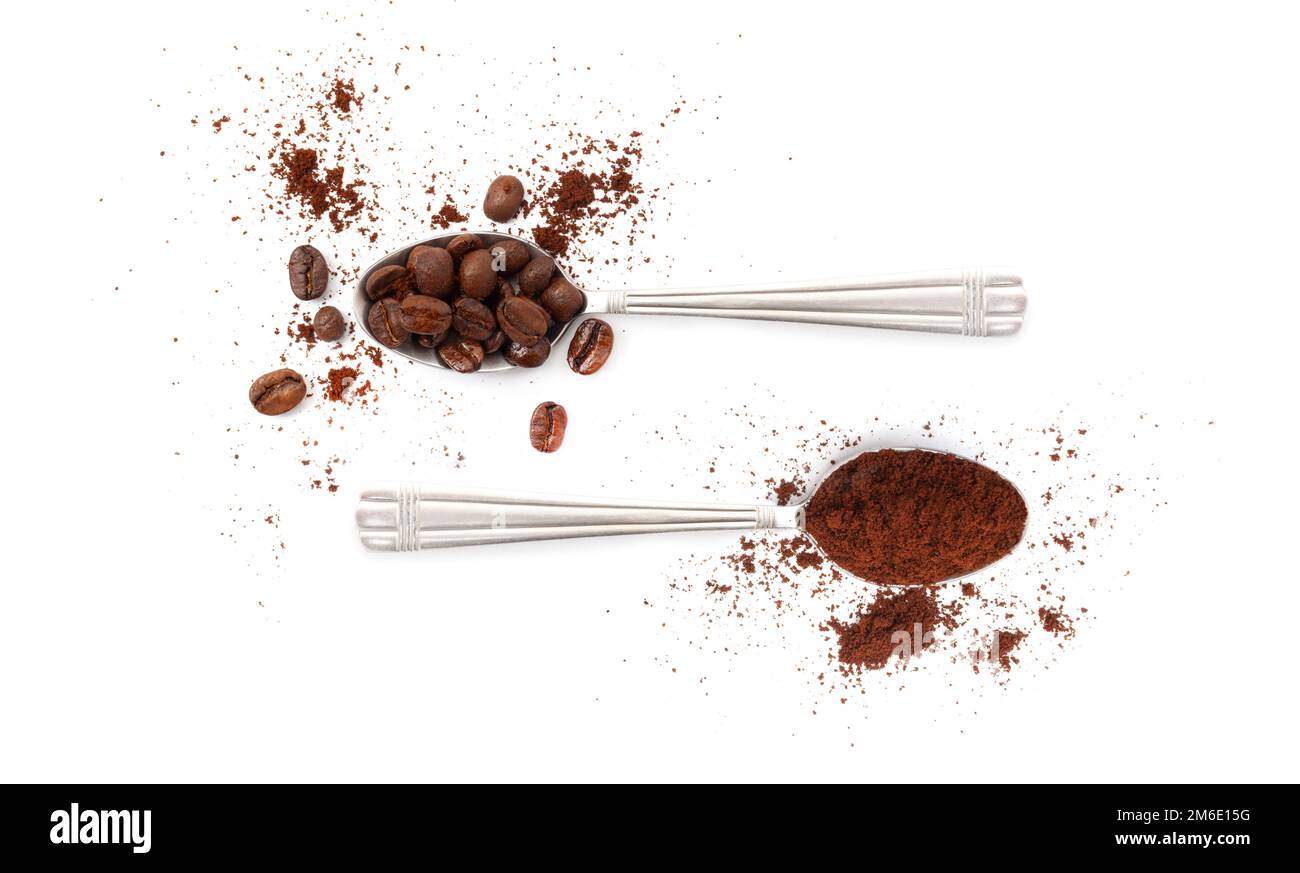 Spoons with coffee beans and coffee powder isolated on white Stock ...