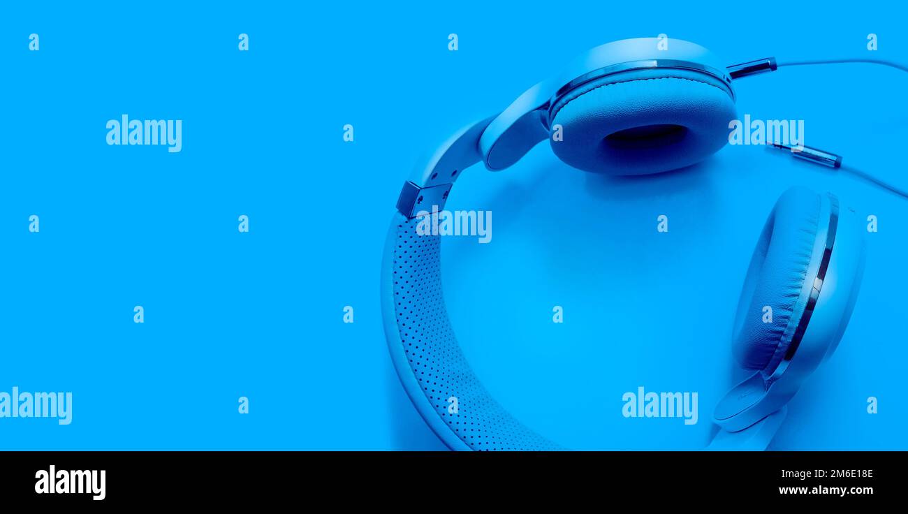 Blue headphones and Convention Aux cable 3.5 mm Stock Photo - Alamy