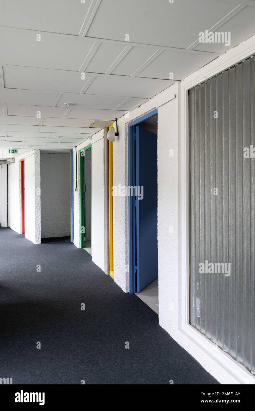 A corridor with urban modern colorful doors at Le Corbusier Masterpiece ...