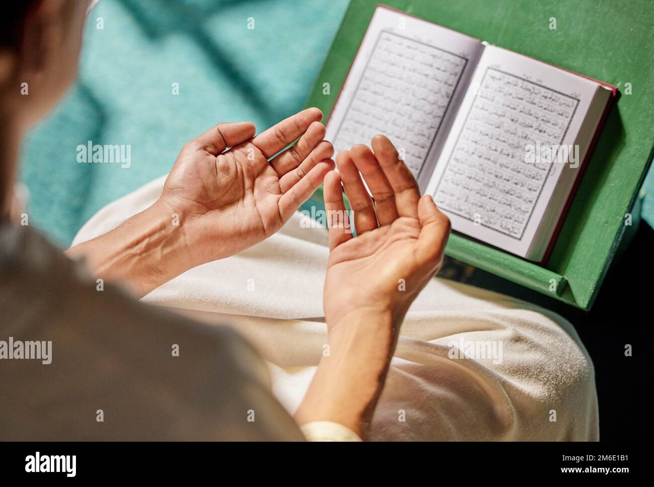 Quran, muslim and man hands praying to allah, god or holy spirit for ...