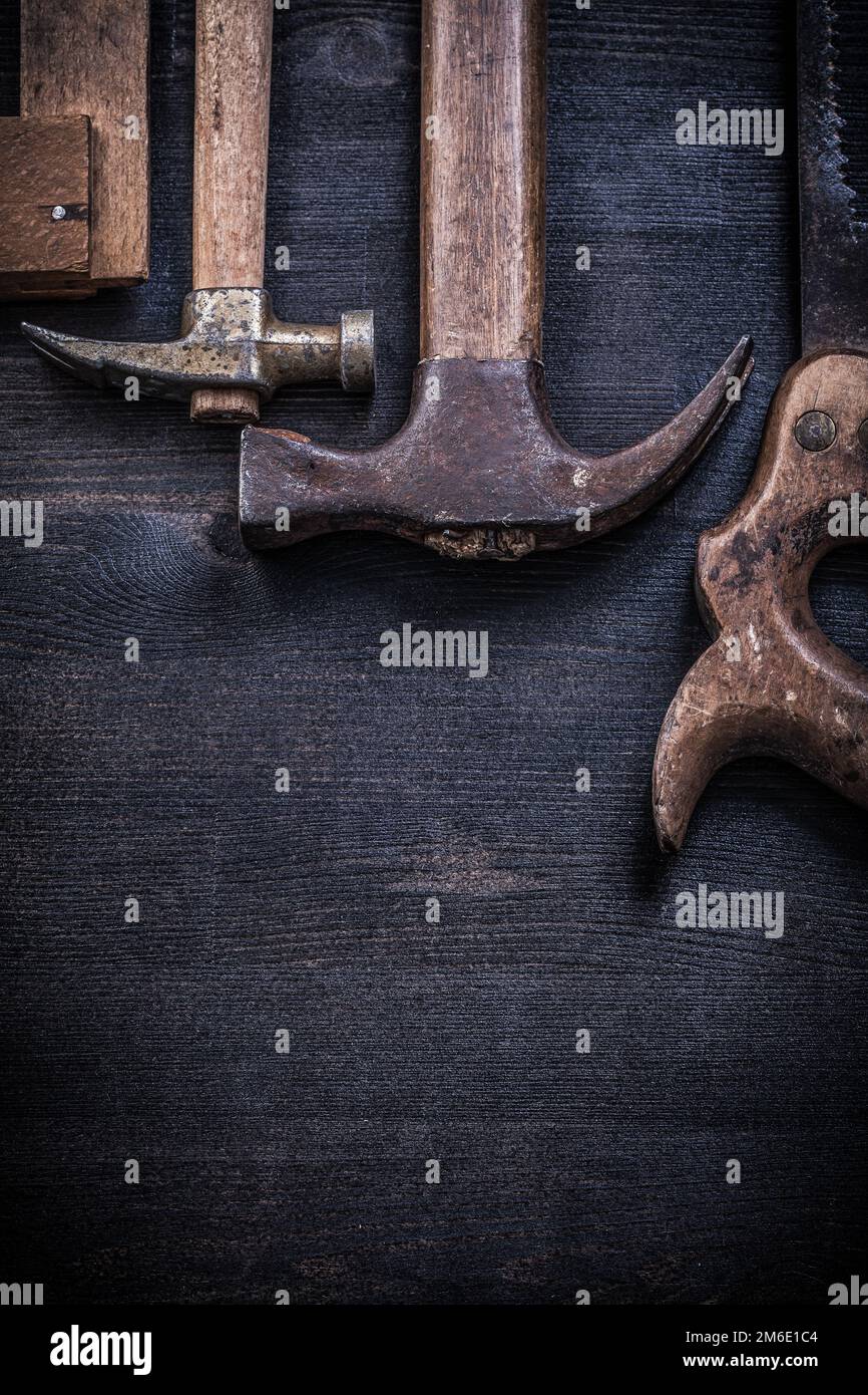Composition of vintage rusted construction tools on wooden board Stock ...