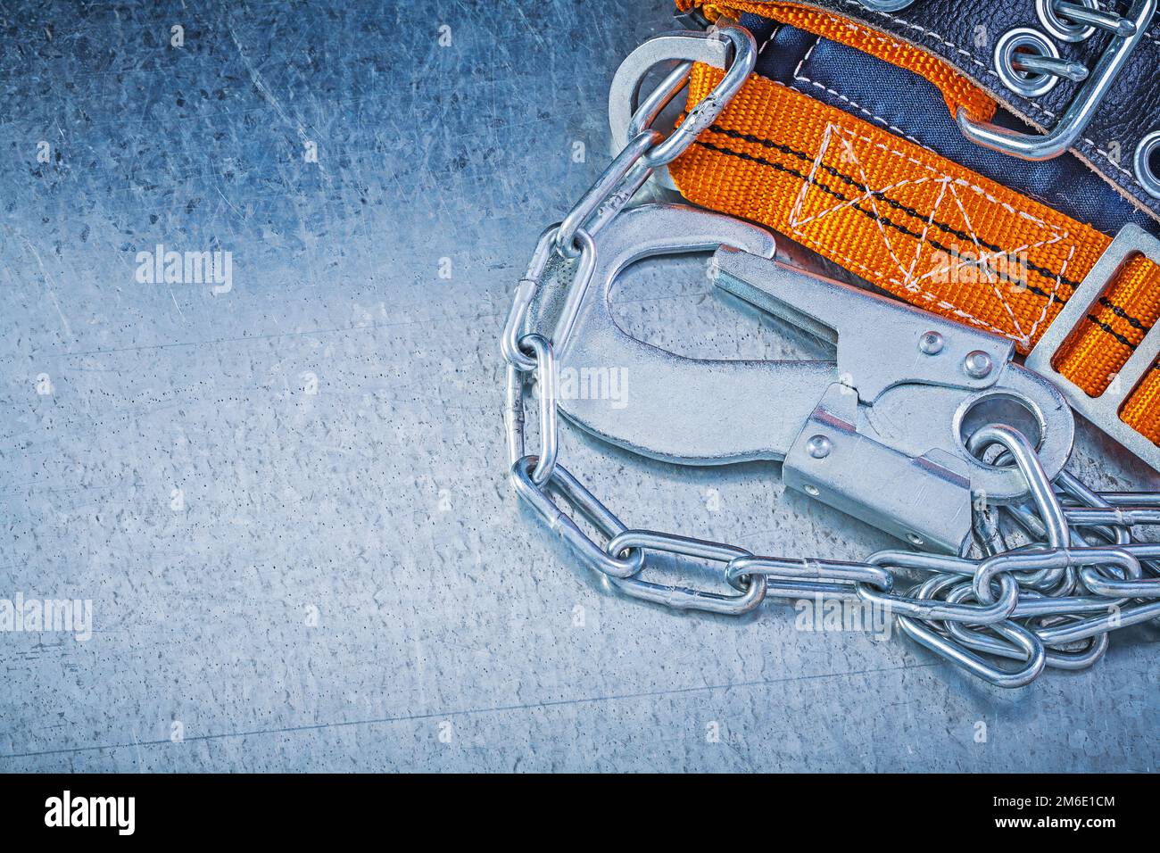Construction safety strap metal chain carabiner on metallic background ...
