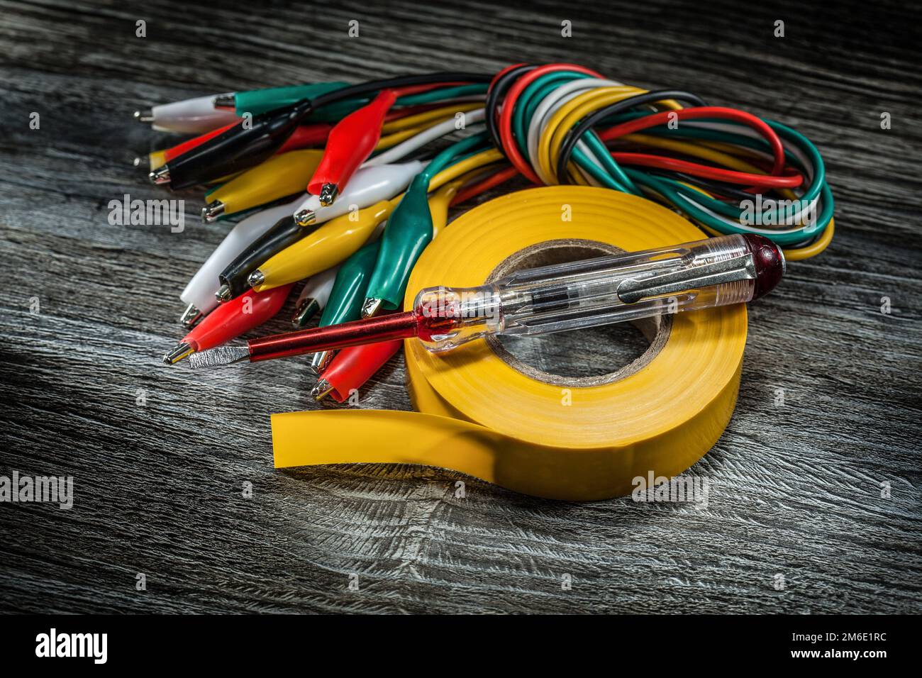 Electric wires electricians tape on vintage wooden board Stock Photo ...