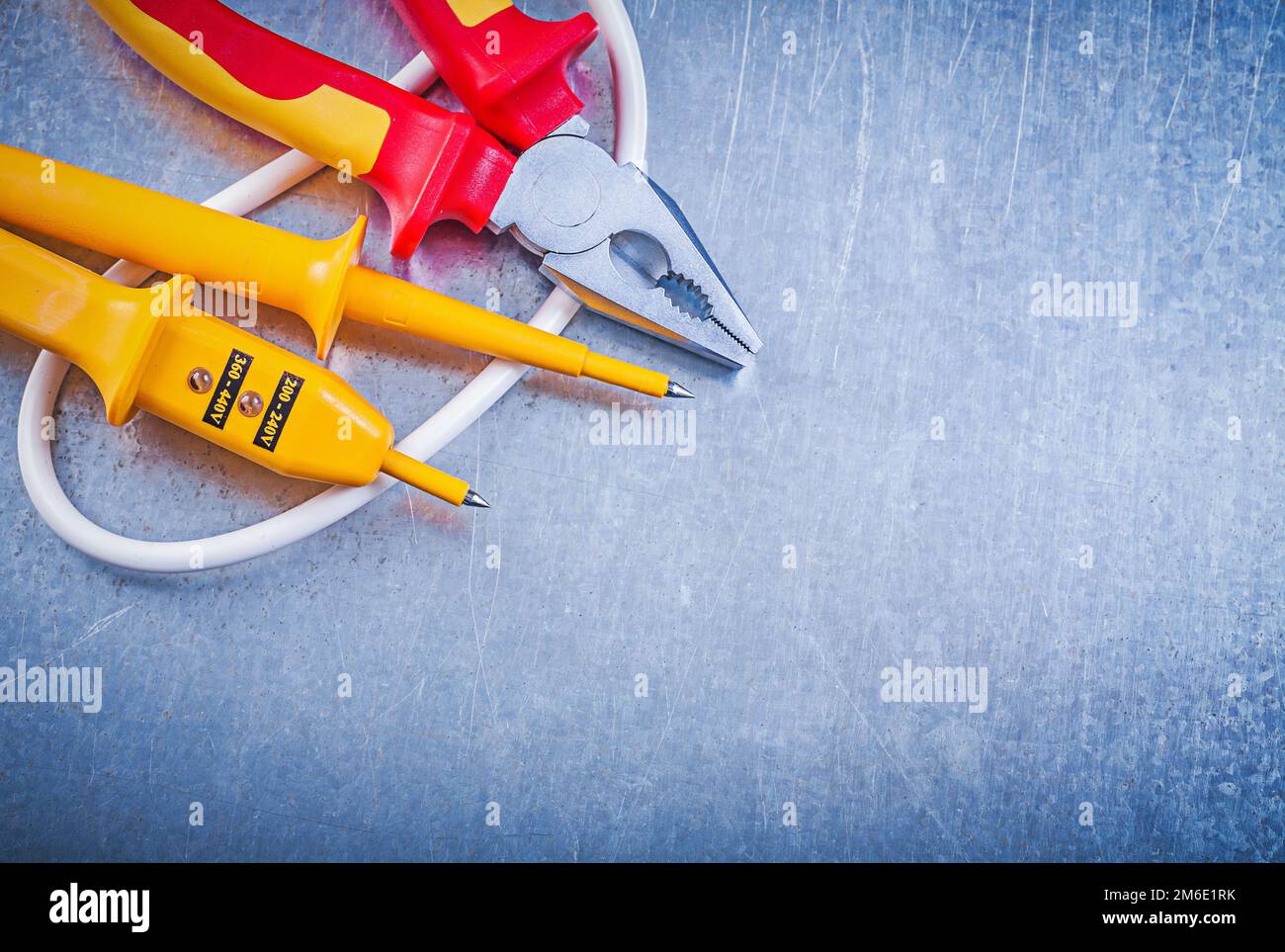 Electric tester pliers on metallic background electricity concept Stock ...