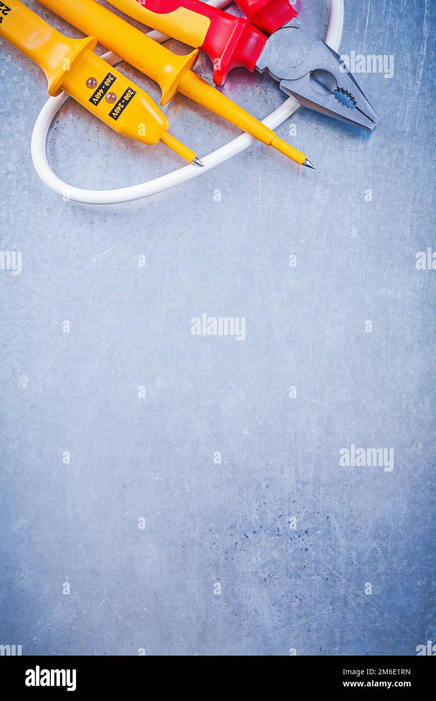 Electric tester pliers on metallic background copyspace electricity ...