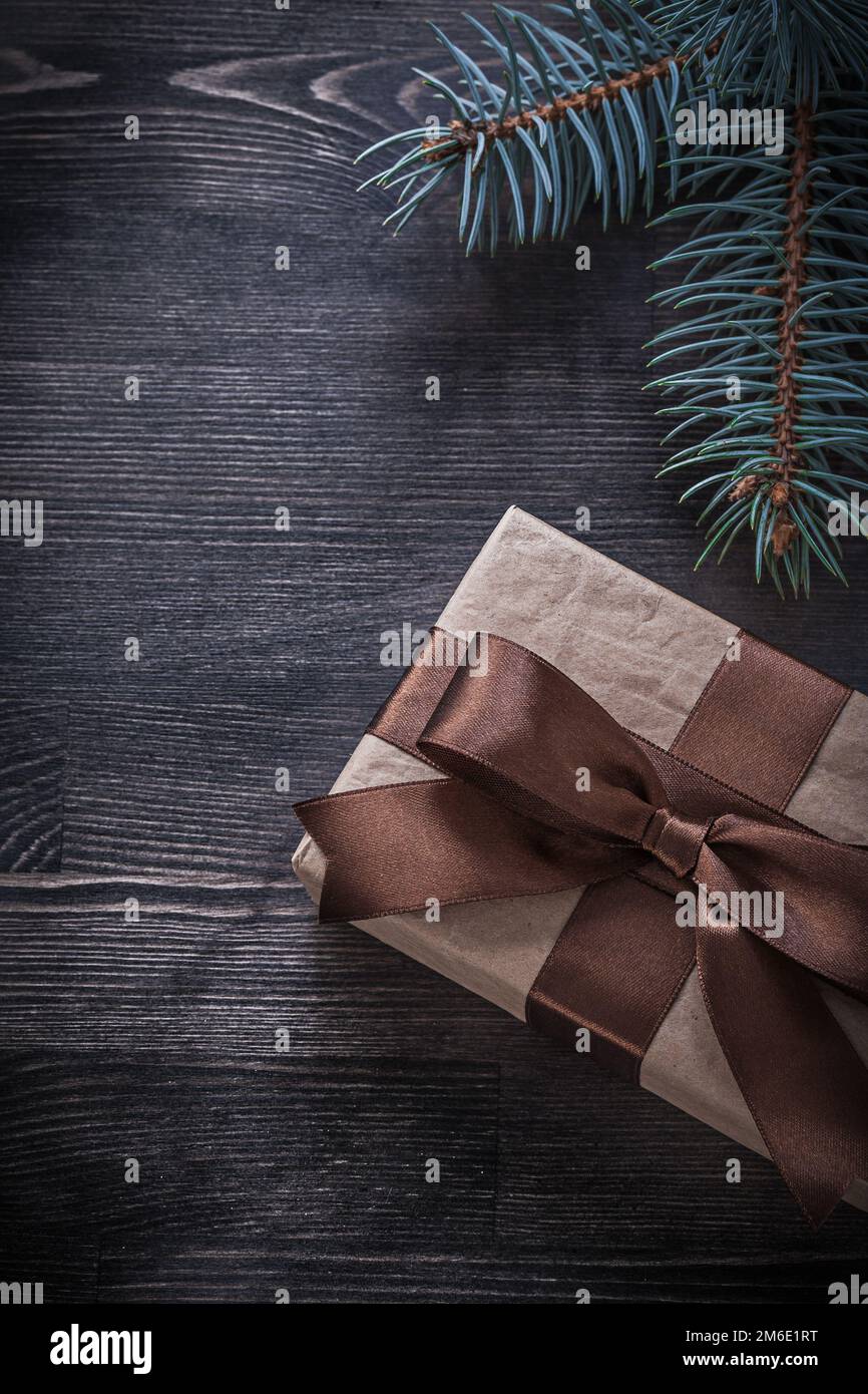 Evergreen tree giftbox on wooden board holiday concept Stock Photo - Alamy