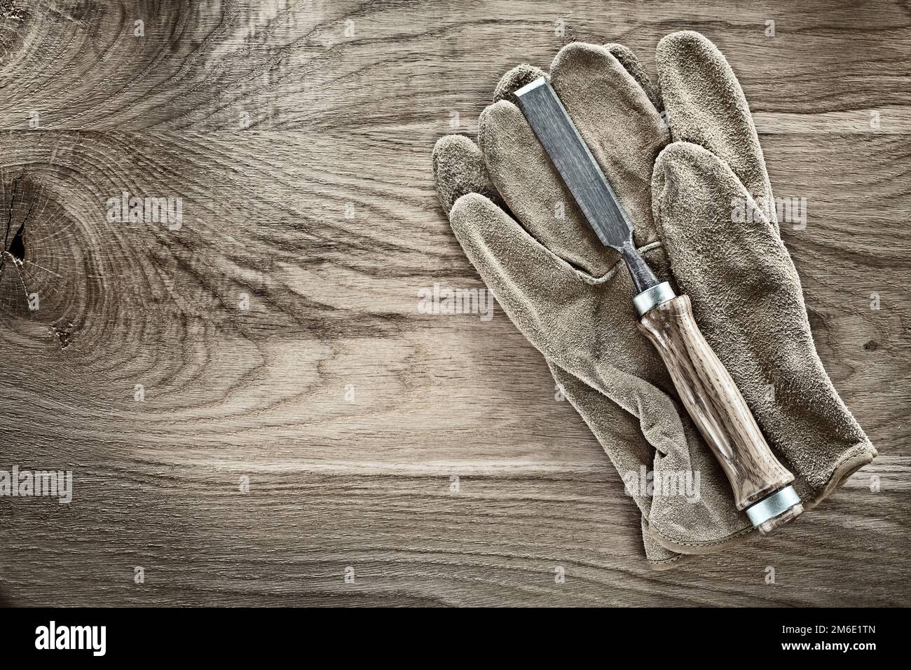 Firmer chisel working gloves on wooden board Stock Photo - Alamy