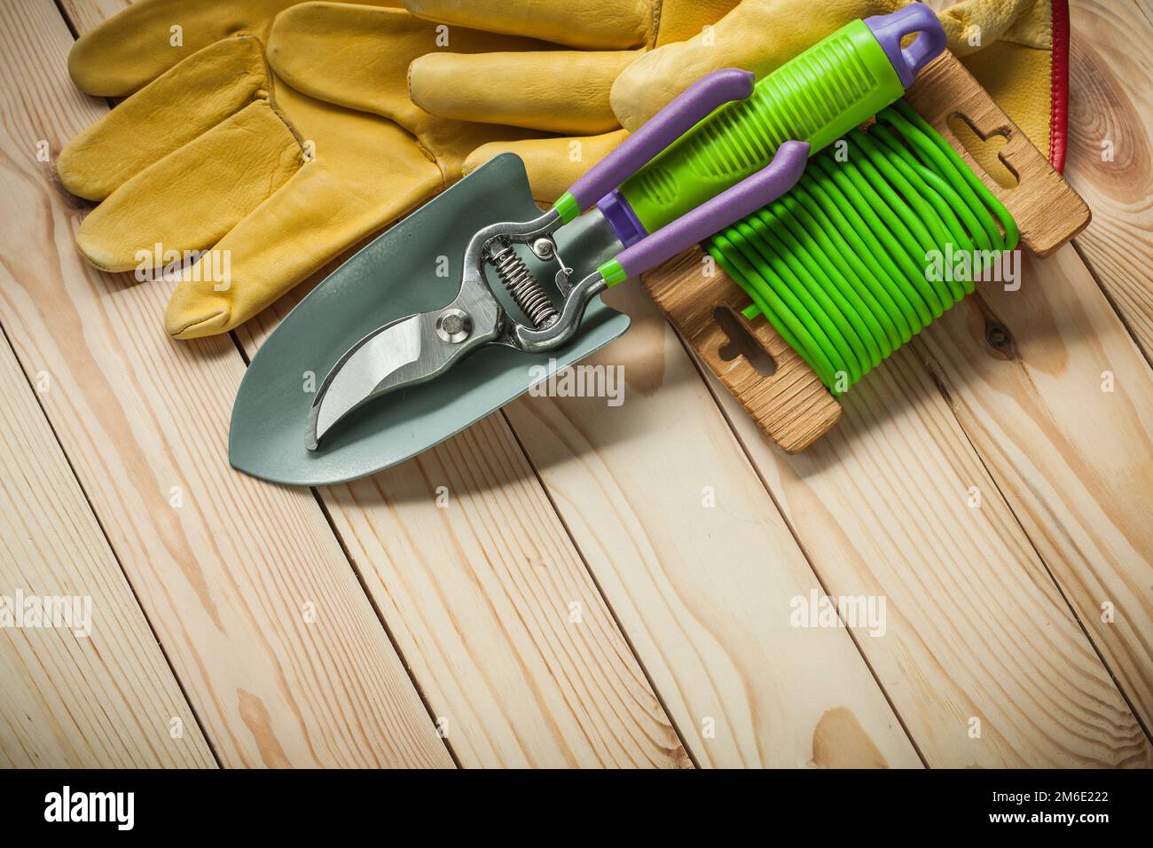 garden tools hand spade secateurs roupe gloves on wood Stock Photo - Alamy
