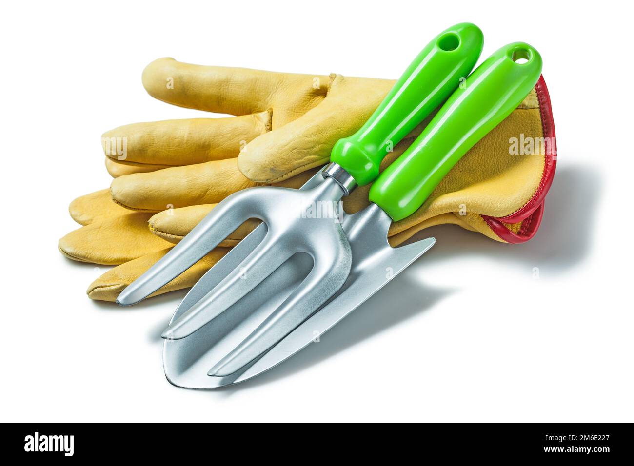 garden fork and hand spade on gloves isolated white Stock Photo - Alamy