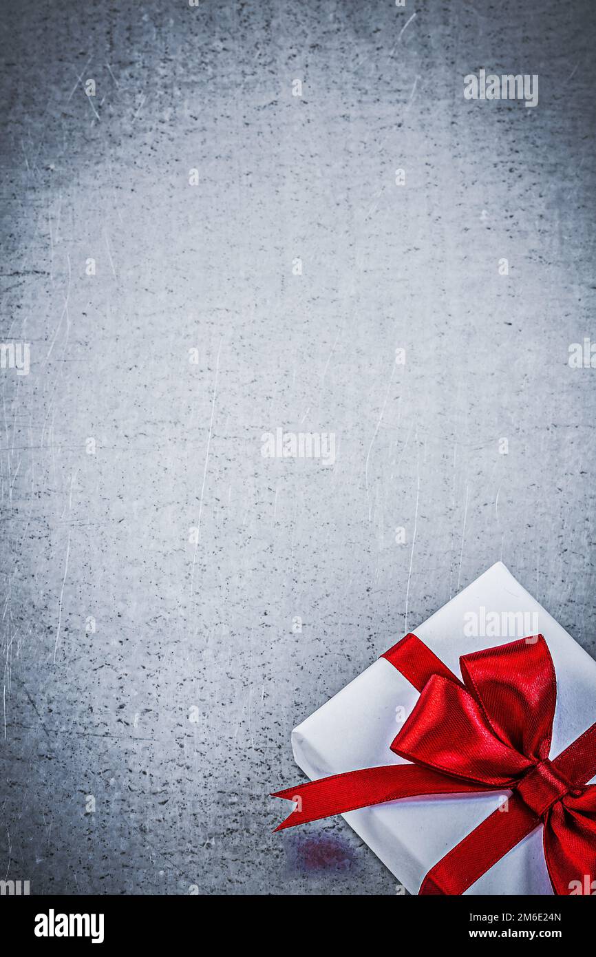 Gift with red bow on metallic background copyspace holidays concept ...