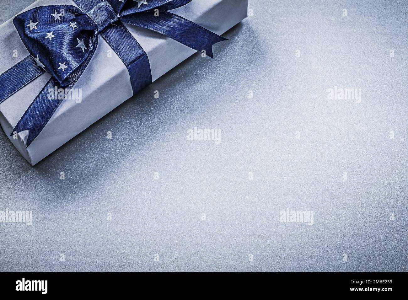 Gift container with bow on blue background holidays concept Stock Photo ...