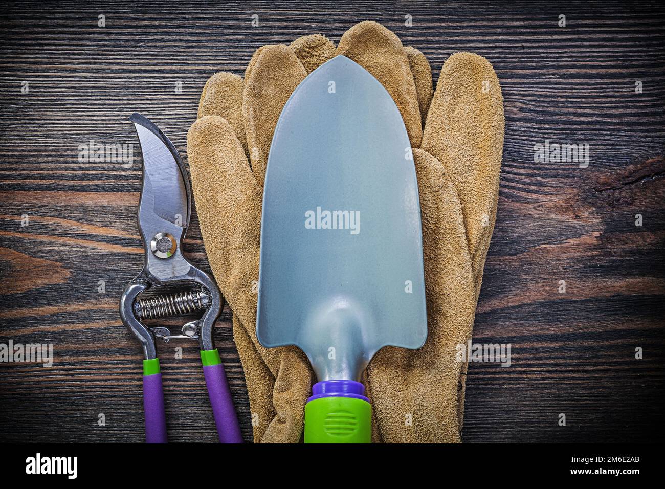 Hand spade secateurs safety gloves on wooden board agriculture concept ...