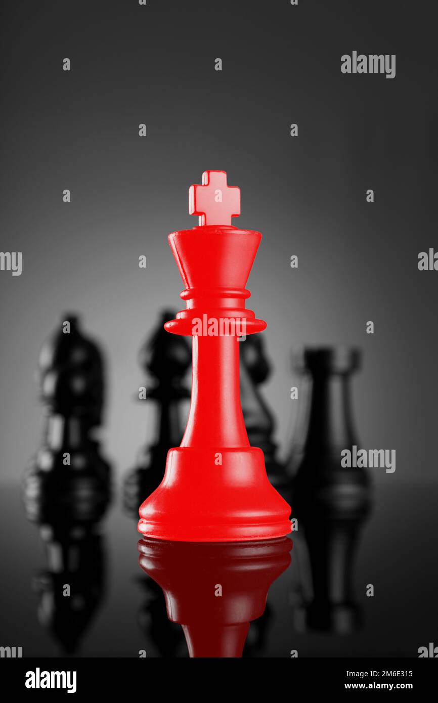Leadership Red Chess King with pieces on dark background Stock Photo ...