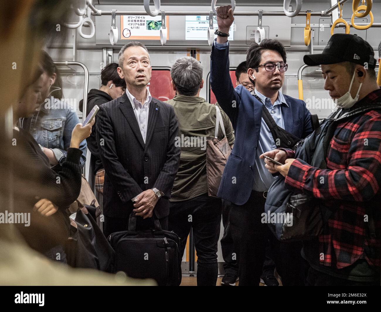 Tokyo, Japan - 10 11 19: people waiting to commute on a busy Tokyo ...
