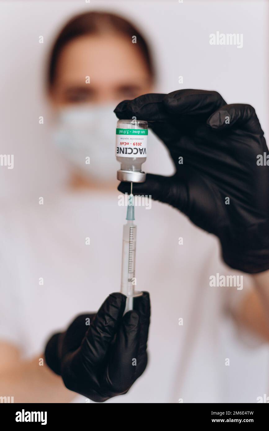 Doctor holds COVID 19 Coronavirus vaccine in his hand, Vaccine and ...