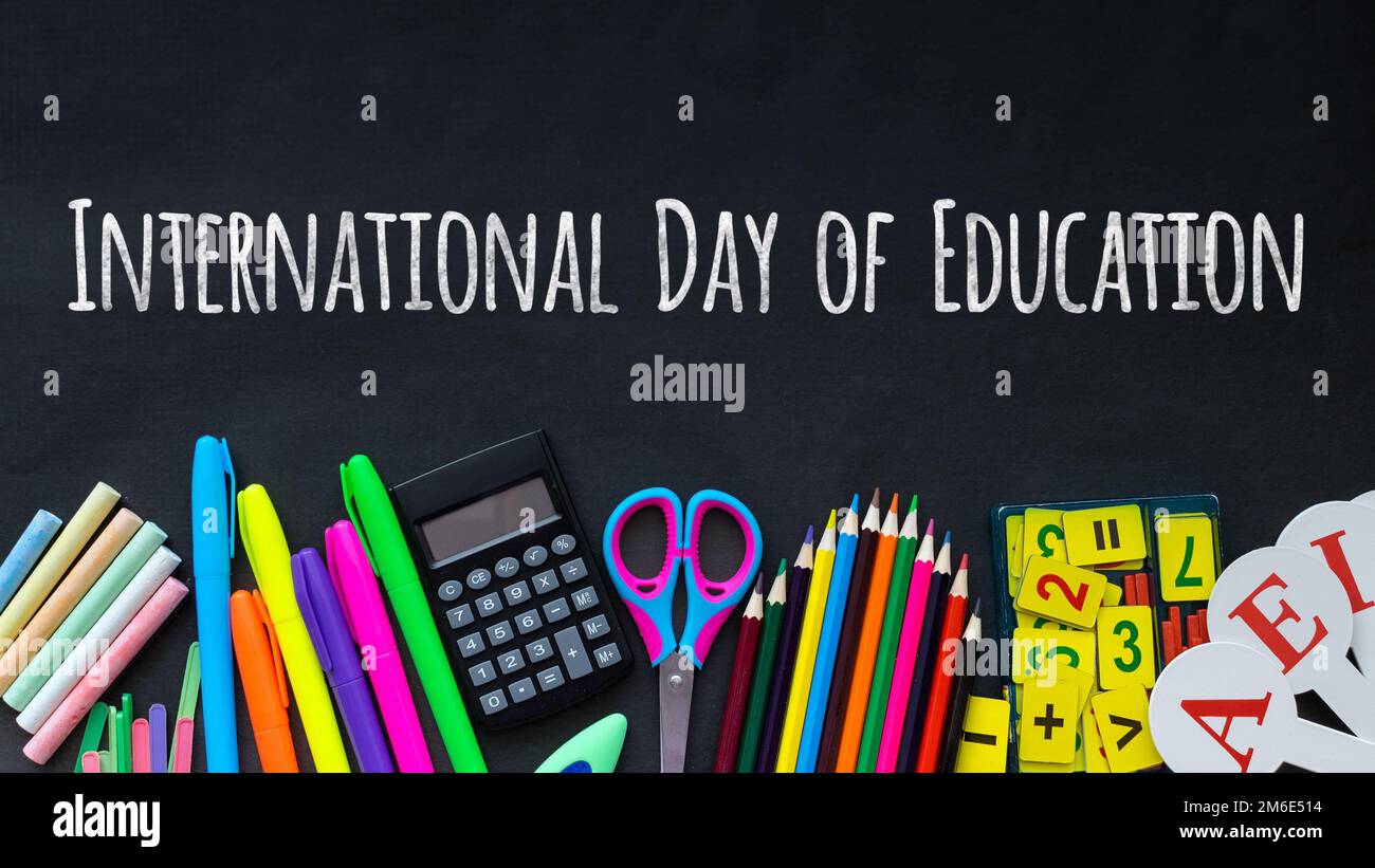 International Day of Education concept with color school supplies on ...