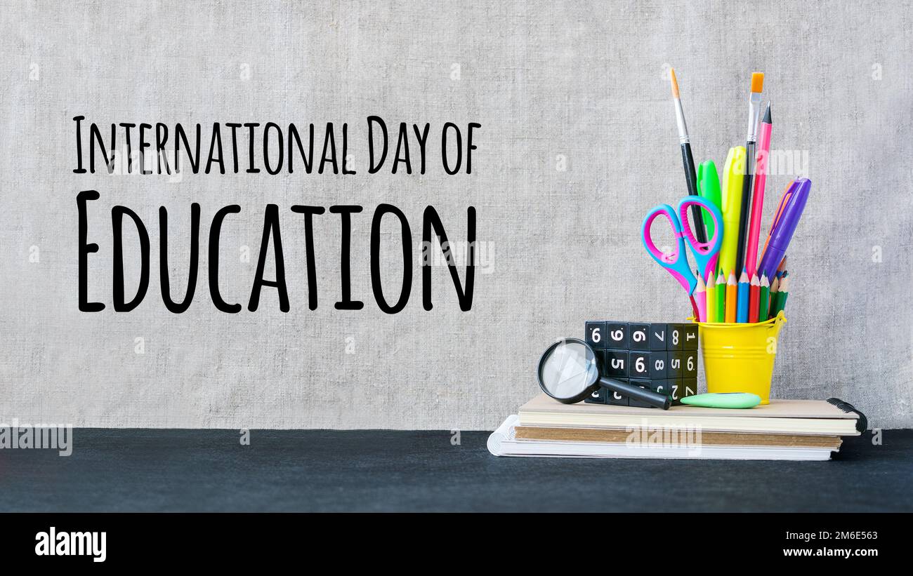 International Day of Education concept with color school supplies on ...