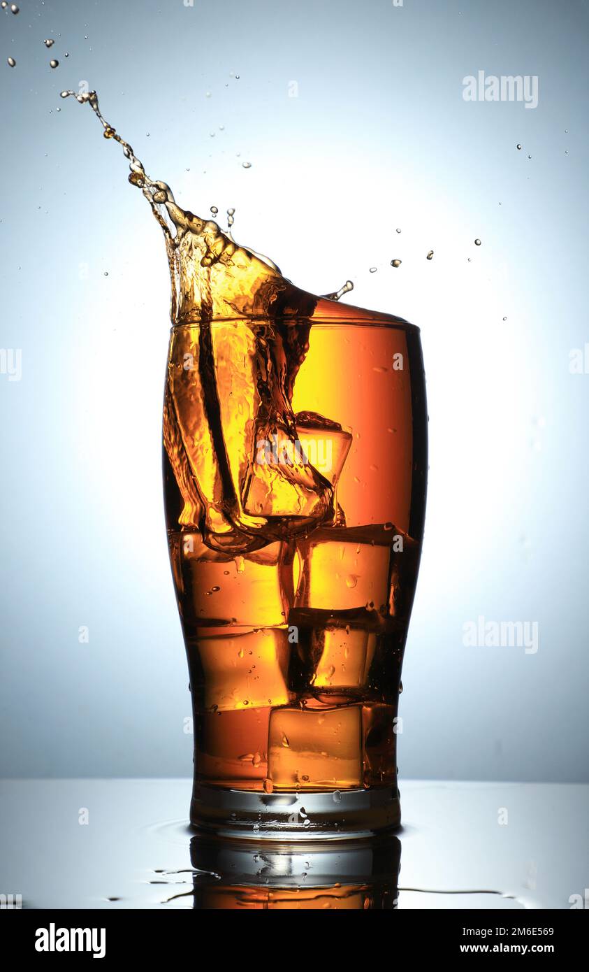 Cold Drink Splash with Ice Cubes Stock Photo - Alamy