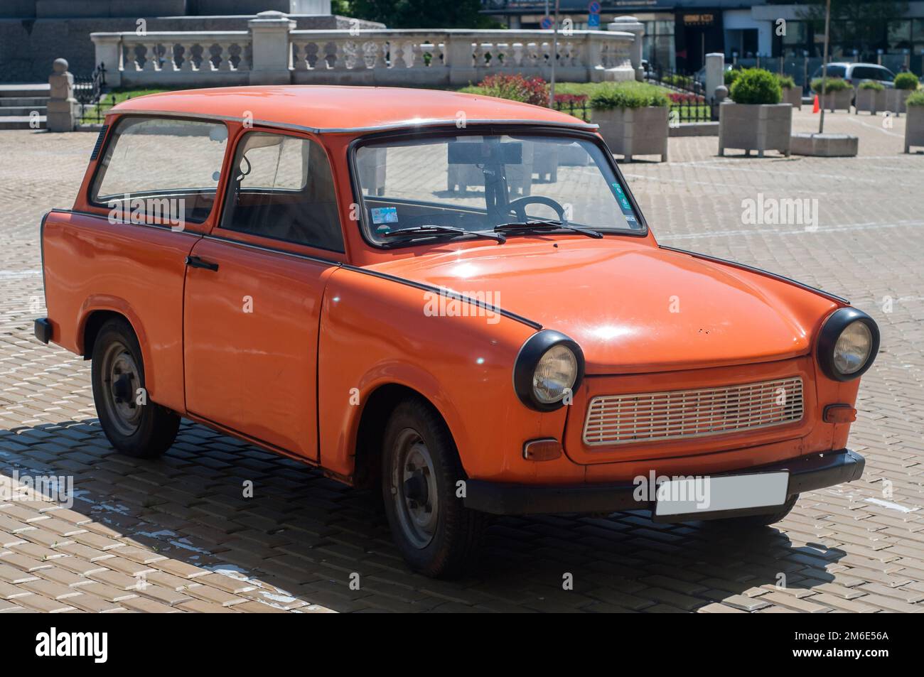 Orange colored vintage restored Trabant car on paved street Stock Photo ...