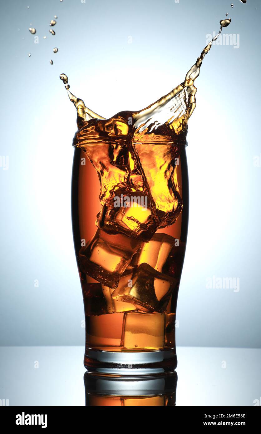 Cold Drink Splash with Ice Cubes Stock Photo - Alamy