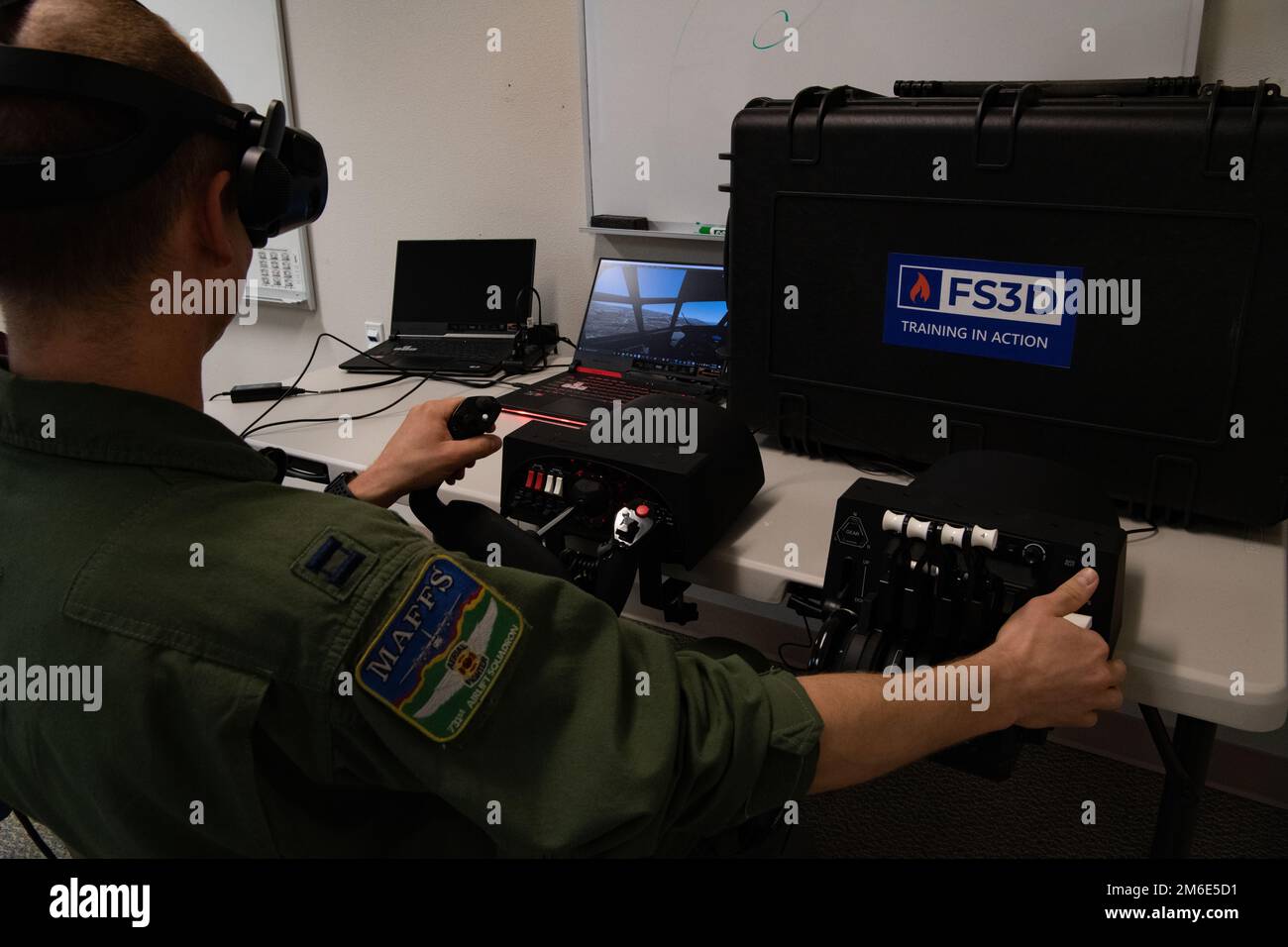 Capt. Erik Anonsen, 731st Airlift Squadron pilot, handles the controls ...