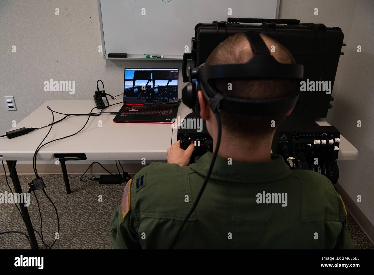 Capt. Erik Anonsen, 731st Airlift Squadron pilot, handles the controls ...