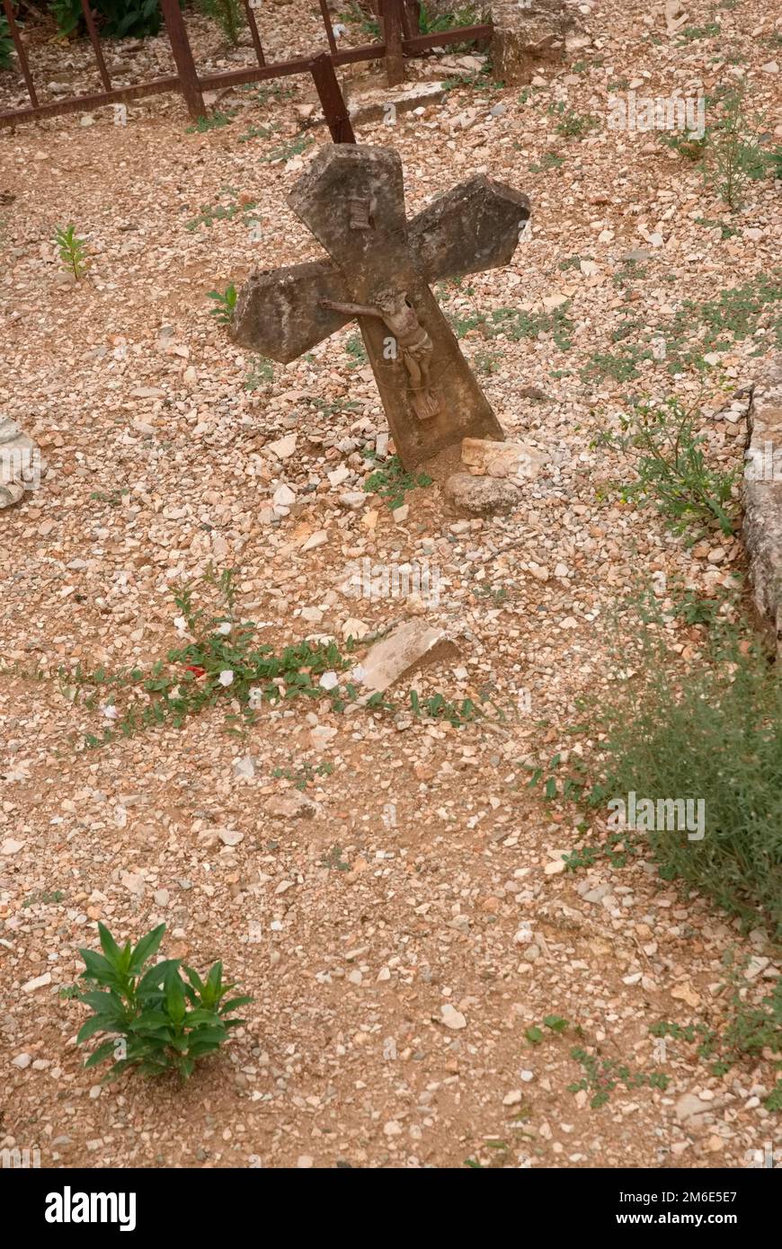 old historical cross of Jesus stuck askew in the ground Stock Photo - Alamy