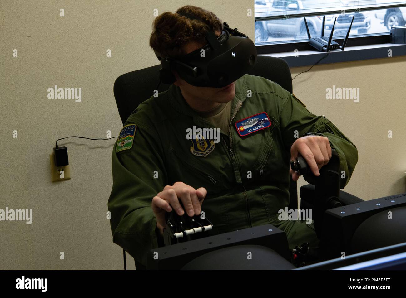 Lt. Col. Jay Capper, 731st Airlift Squadron pilot, handles the controls ...