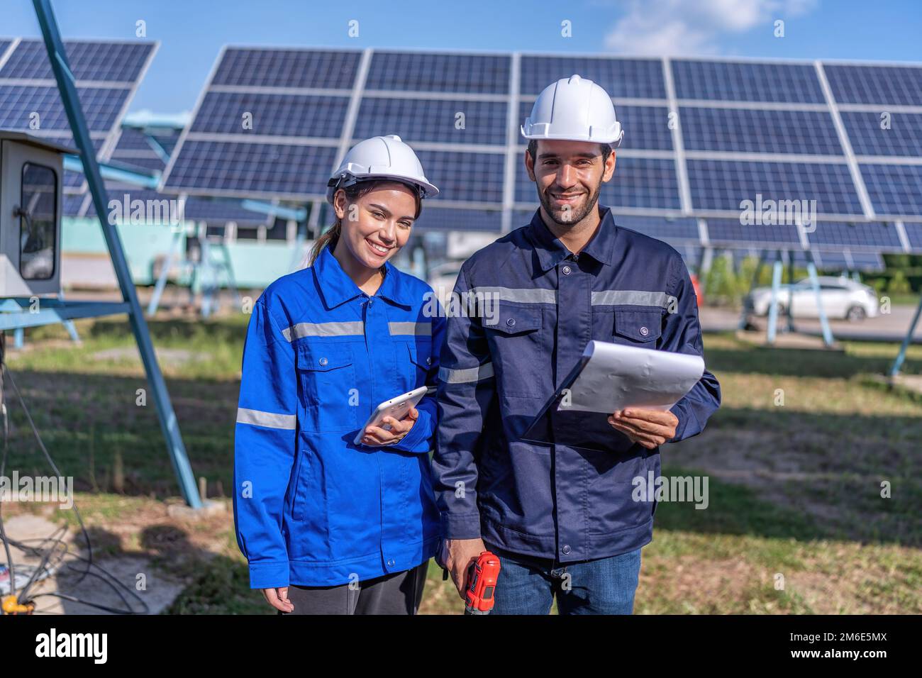 Maintenance engineer at solar farm hold drill machine and checklist ...