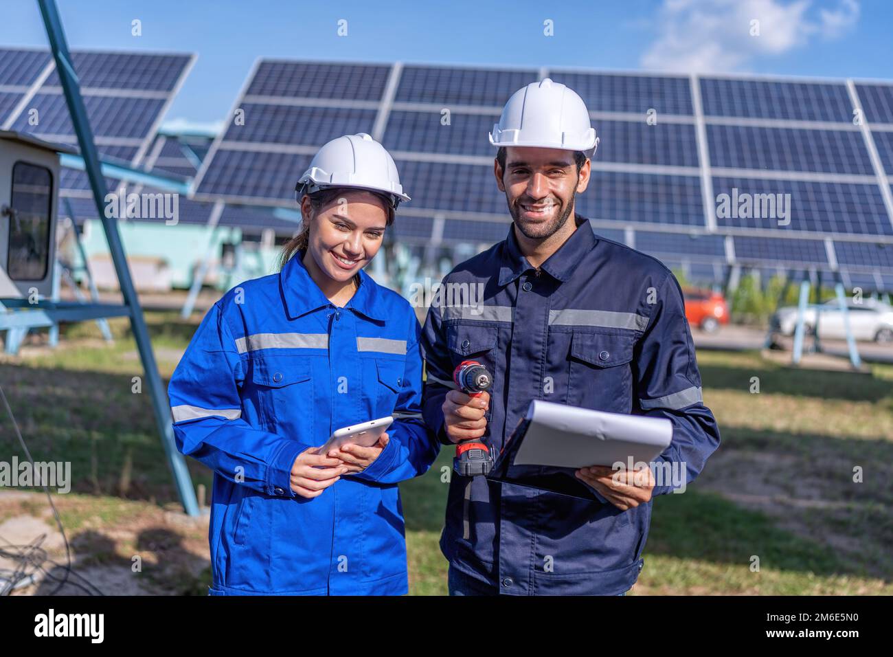 Maintenance engineer at solar farm hold drill machine and checklist ...