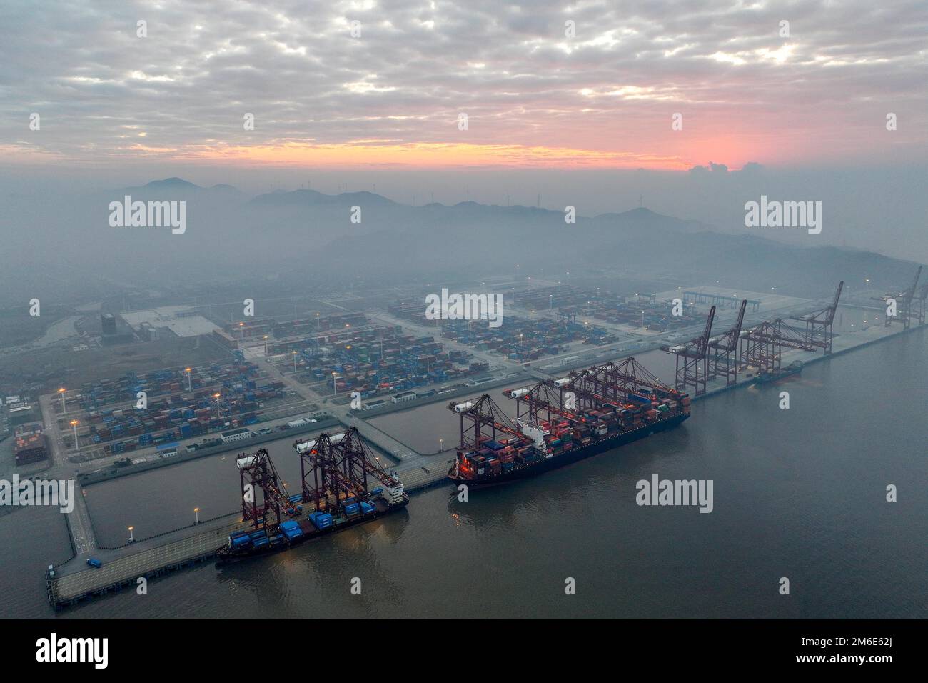 Aerial photo shows the bridge cranes loading and unloading container ...
