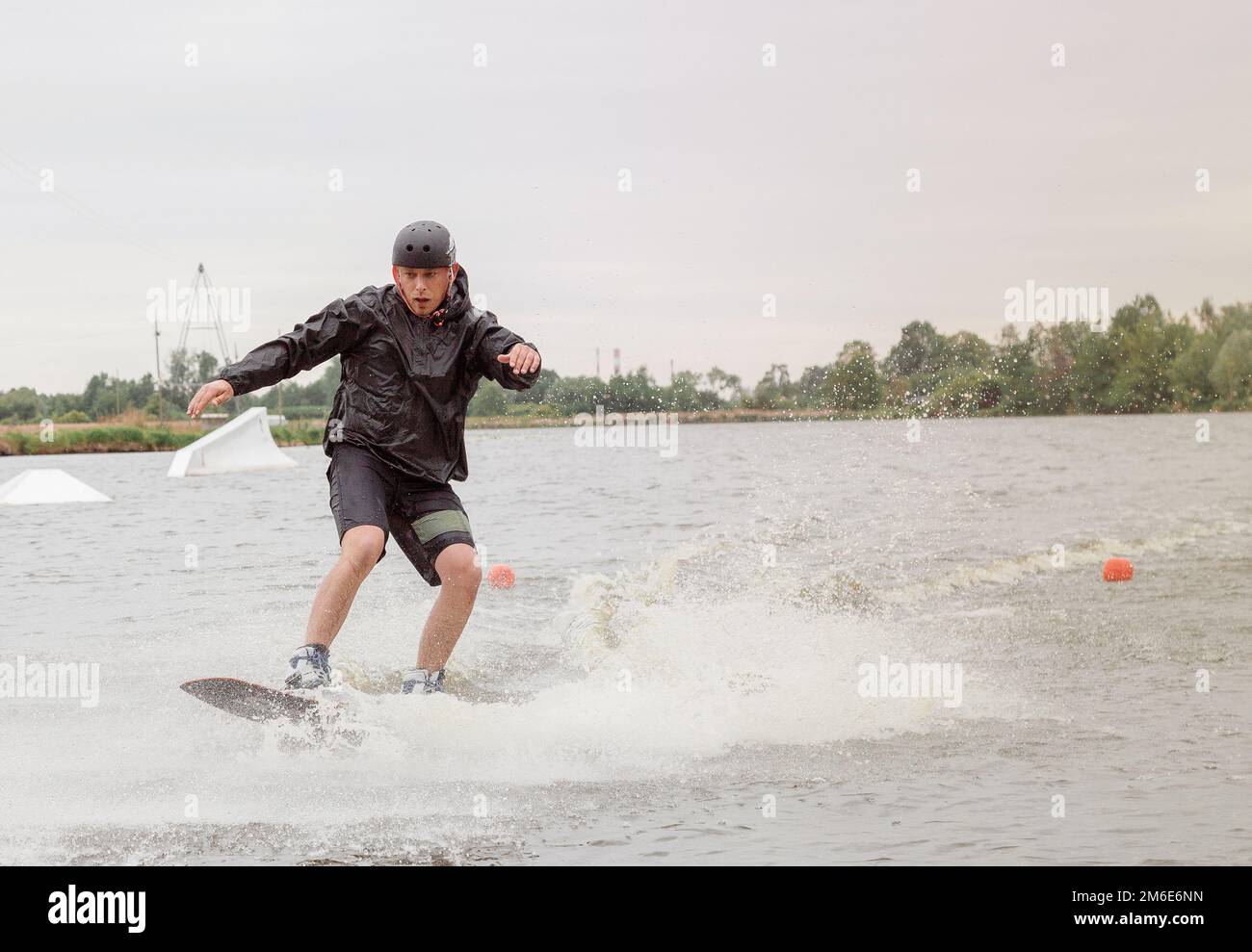 Male wakeboarder swims board hi-res stock photography and images - Alamy