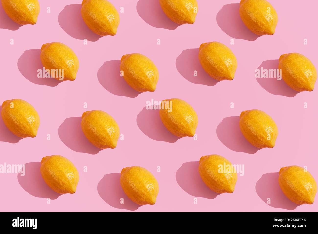 Trendy yellow lemon isometric pattern on pink background. Creative ...